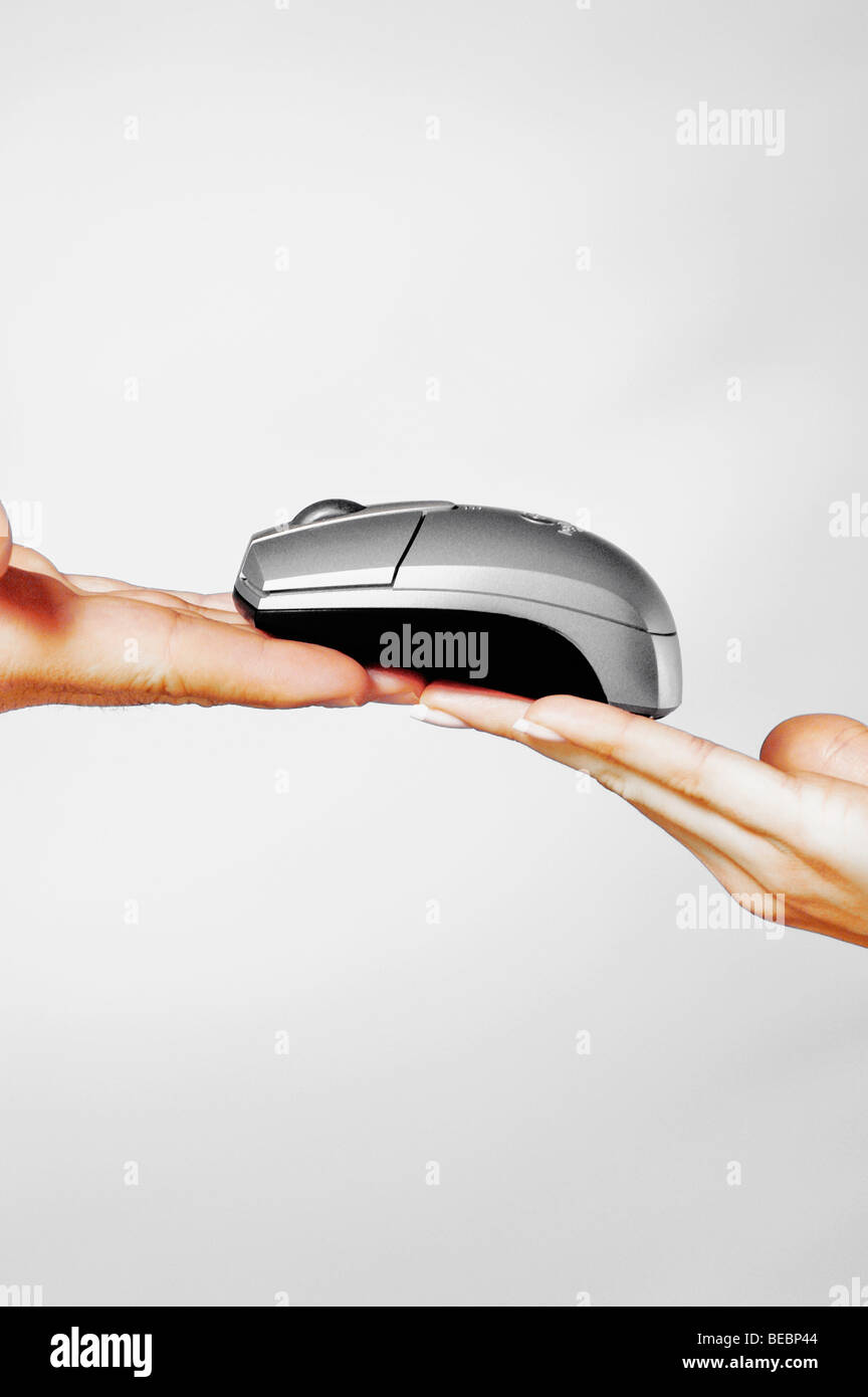 Close-up of a couple's hands holding a computer mouse Stock Photo - Alamy