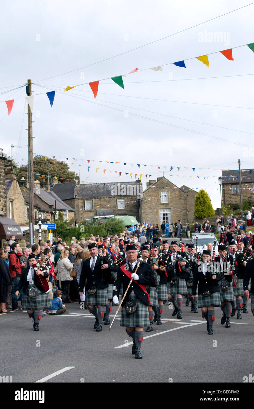 Marching band at Eyam village carnival with fancy dress parade in the ...