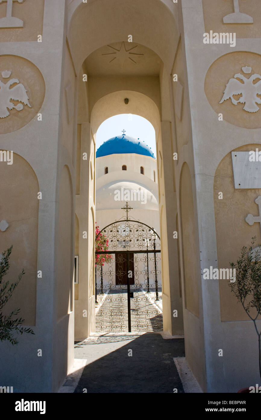 Beautiful blue church roof, through stone archway, Perissa, Santorini ...