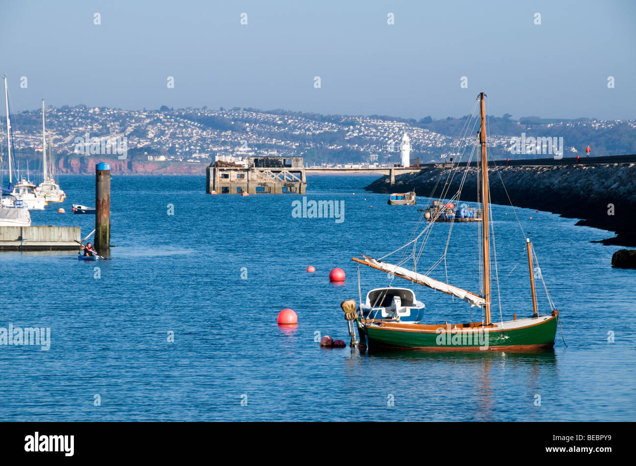 Lighthouse and derelict quayside, Brixham Harbour, Devon, UK Stock ...