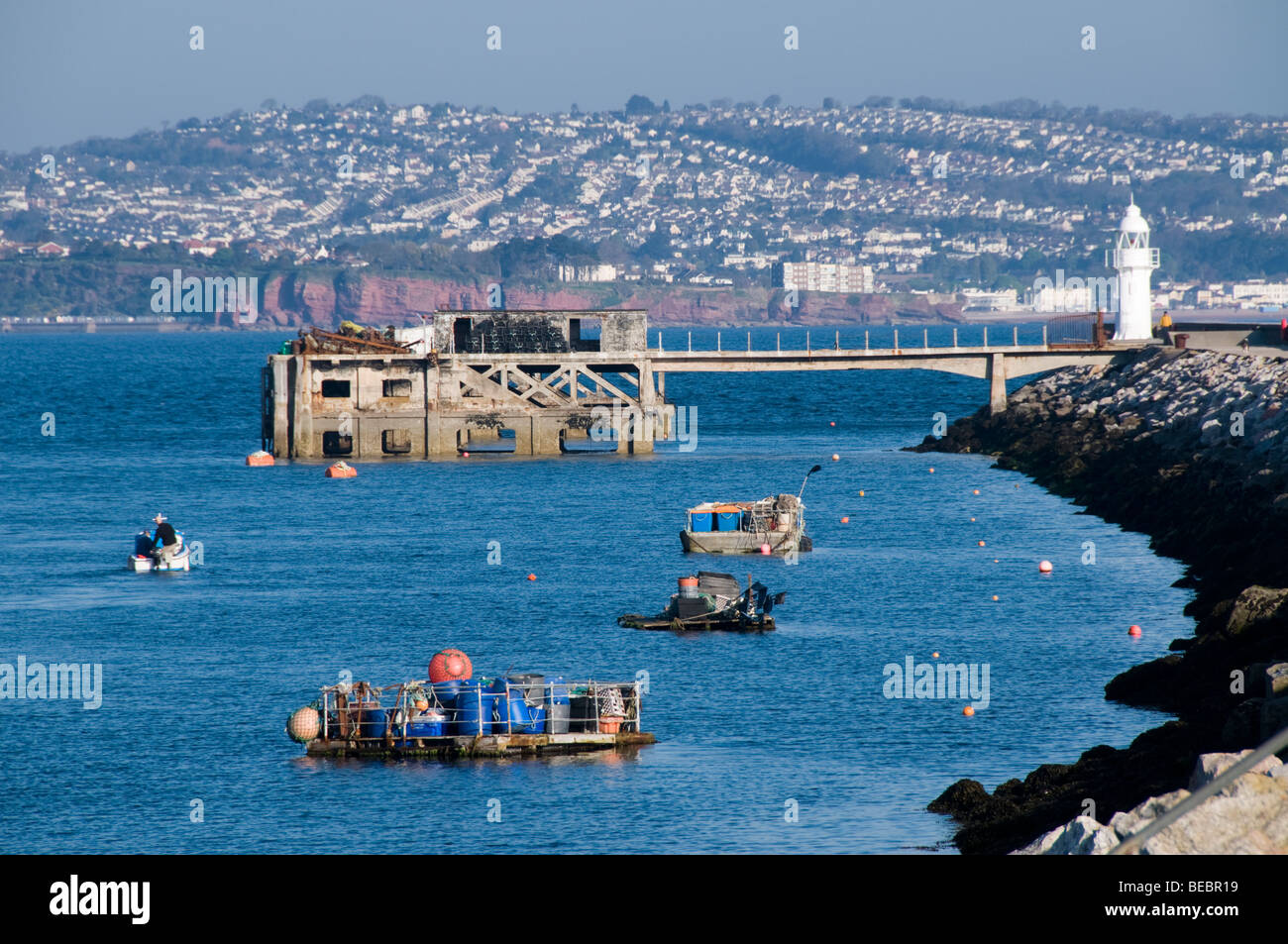 Lighthouse and derelict quayside, Brixham Harbour, Devon, UK Stock ...