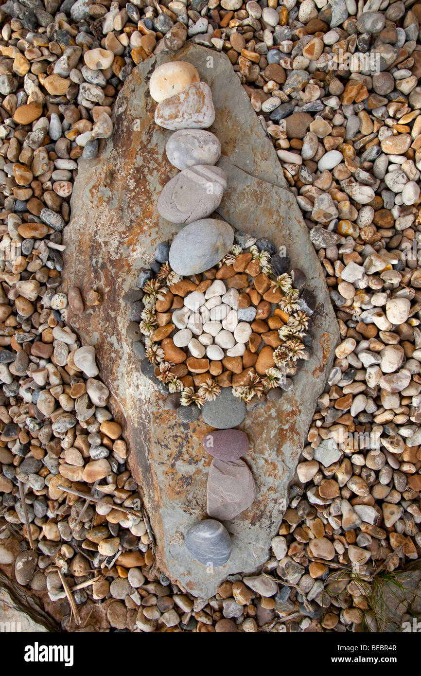 pebbles arranged on a rock Stock Photo - Alamy