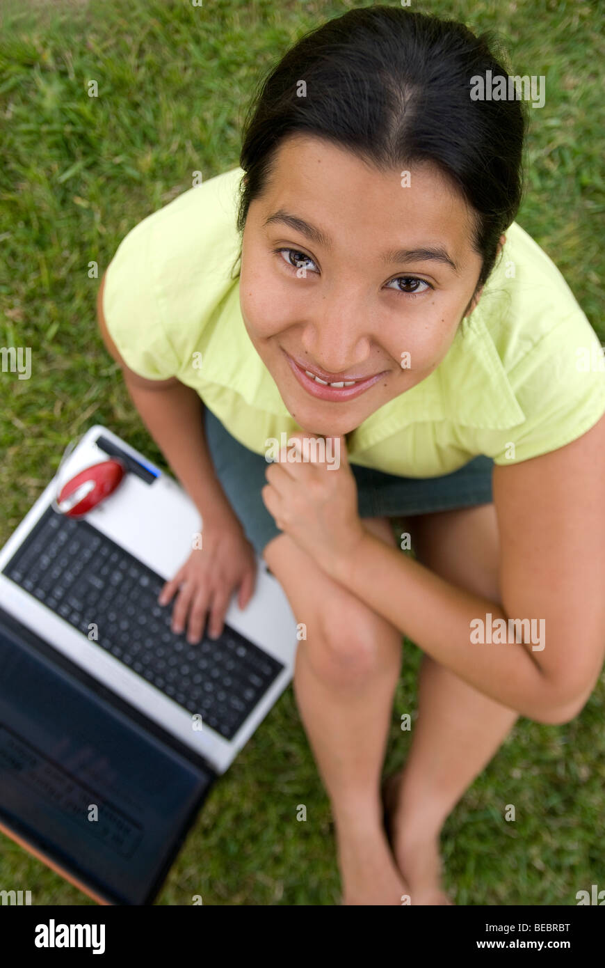 Hispanic woman with laptop computer Stock Photo - Alamy
