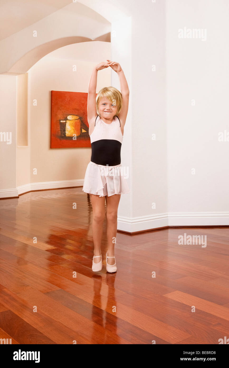 Girl practicing ballet in a house Stock Photo - Alamy