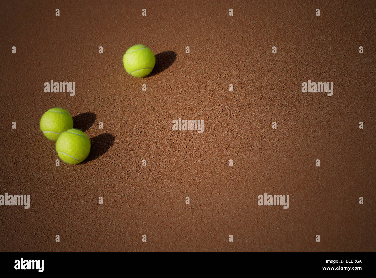 High angle view of three tennis balls in a court Stock Photo - Alamy