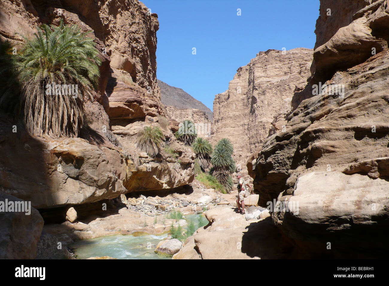 A tour guide stops on a canyoning tour of Wadi Zarqa, between Hammamat ...