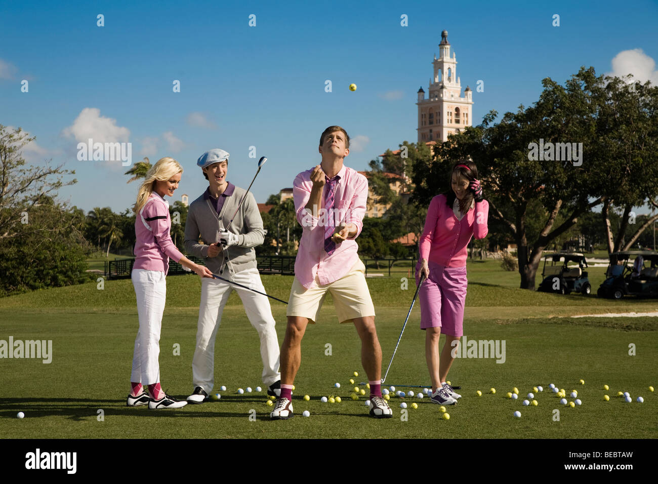 Four friends having fun in a golf course, Biltmore Golf Course, Coral ...