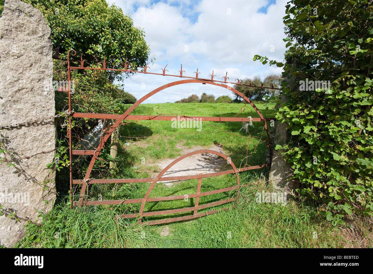 Old rusty iron gate Stock Photo - Alamy