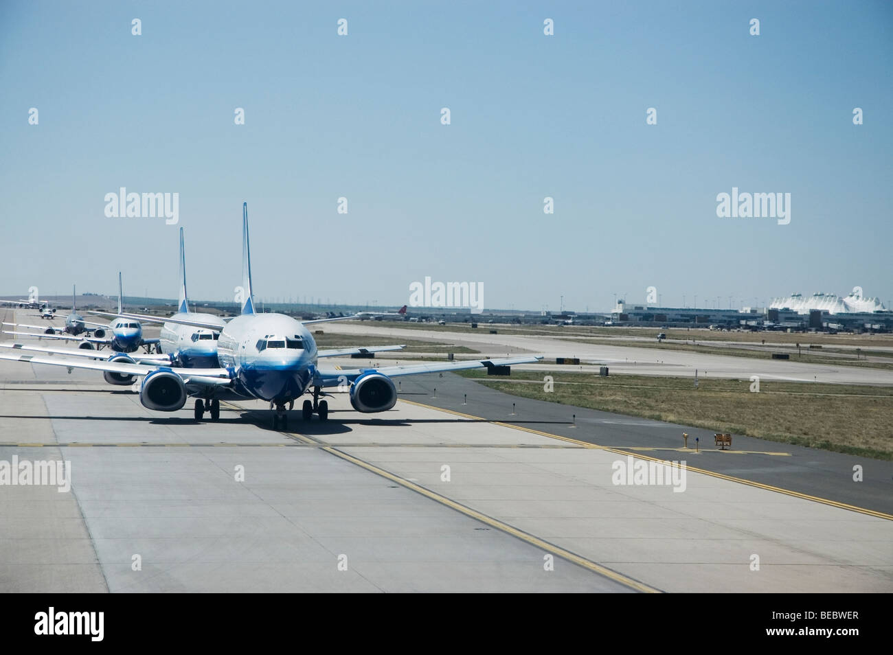 Airplanes in a row on a runway Stock Photo - Alamy