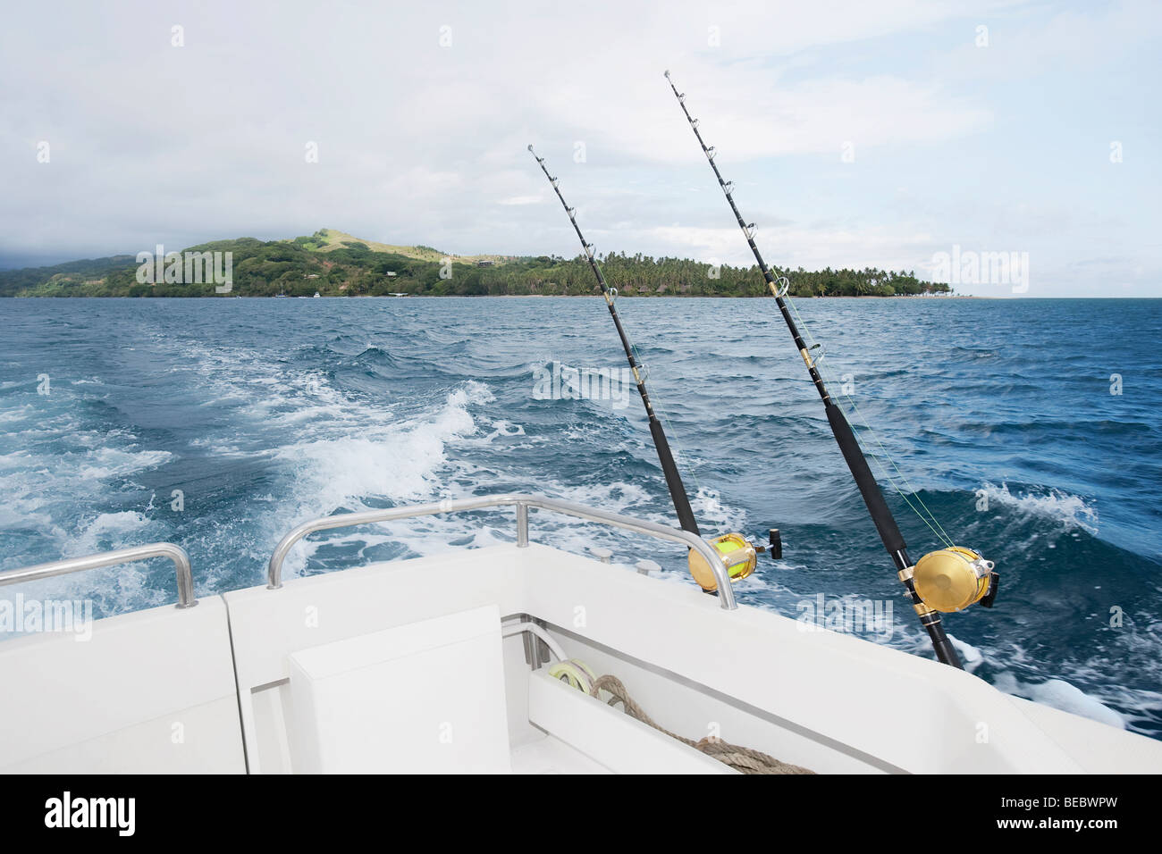 Fishing rods on a boat Stock Photo - Alamy