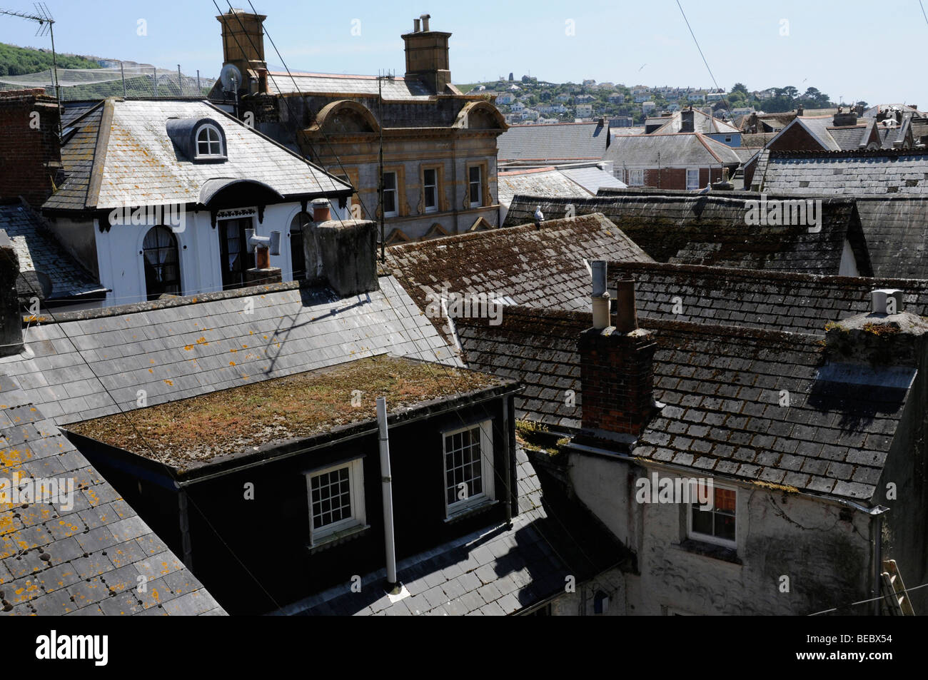 Cramped slate roof tops of the traditional Cornish village, Fowey on a ...