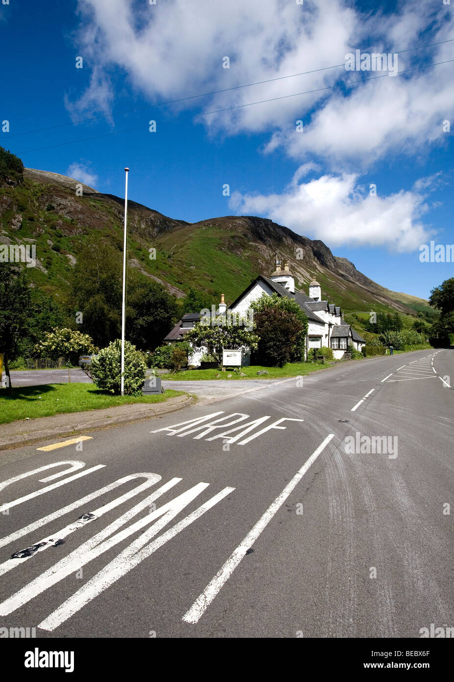 a welsh pub hotel on a slow araf road with Cadar idris mountain range ...
