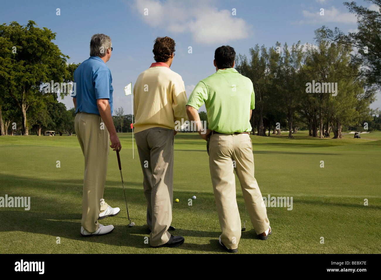 Three golfer standing in a golf course, Biltmore Golf Course, Coral ...