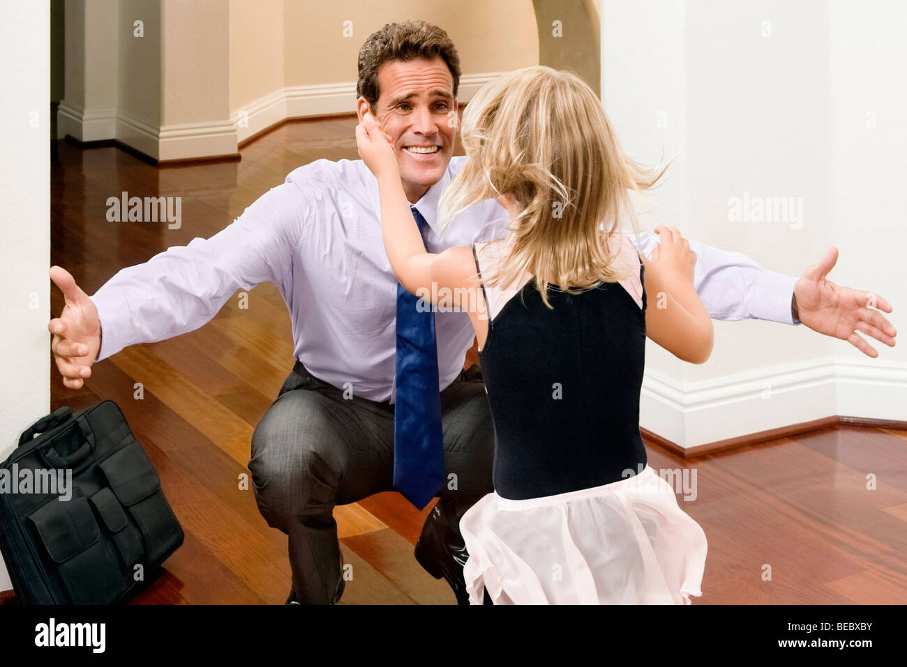 Father arriving home family welcome hi-res stock photography and images ...