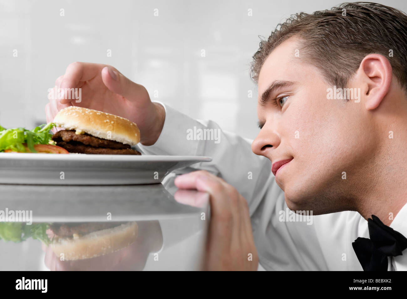 Man eating burger side hi-res stock photography and images - Alamy
