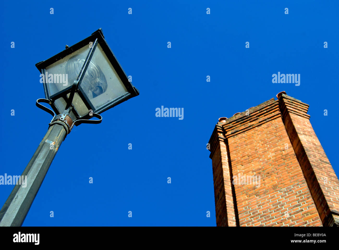 victorian style street lamp and tall brick chimney, typical features of ...