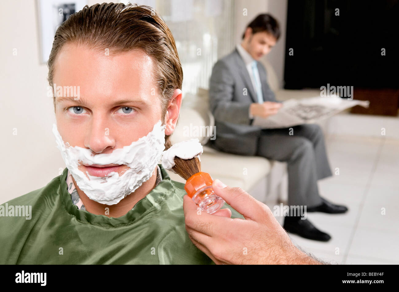 Man getting shaved in salon hi-res stock photography and images - Alamy