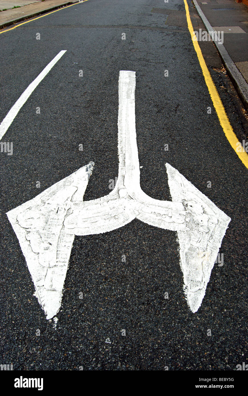 british double arrow head road marking indicating traffic can turn left ...