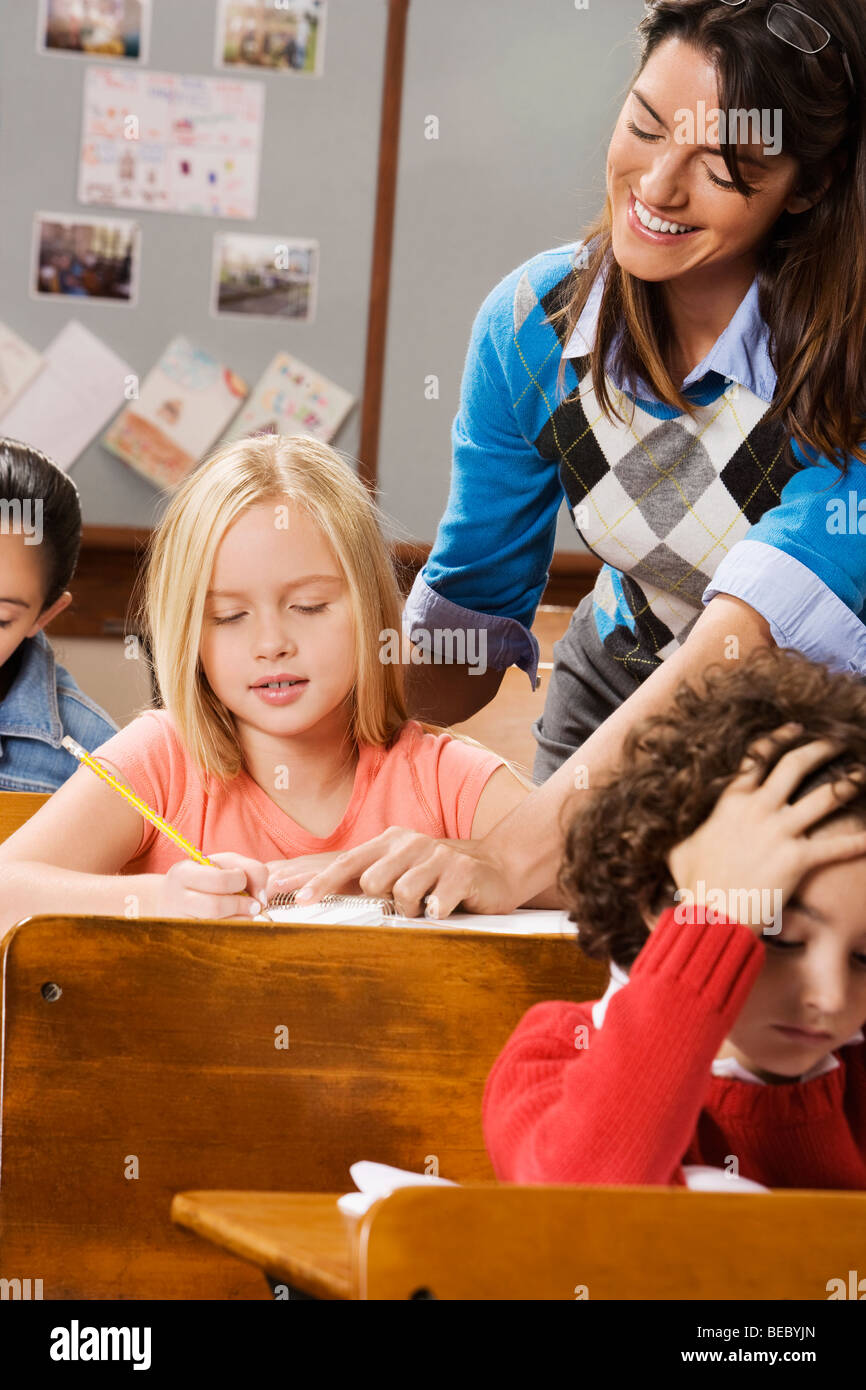Students with their teacher in a classroom Stock Photo - Alamy