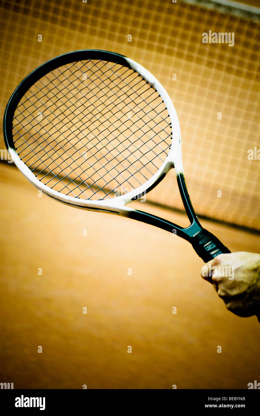 Close-up of a person's hand holding a tennis racket Stock Photo - Alamy