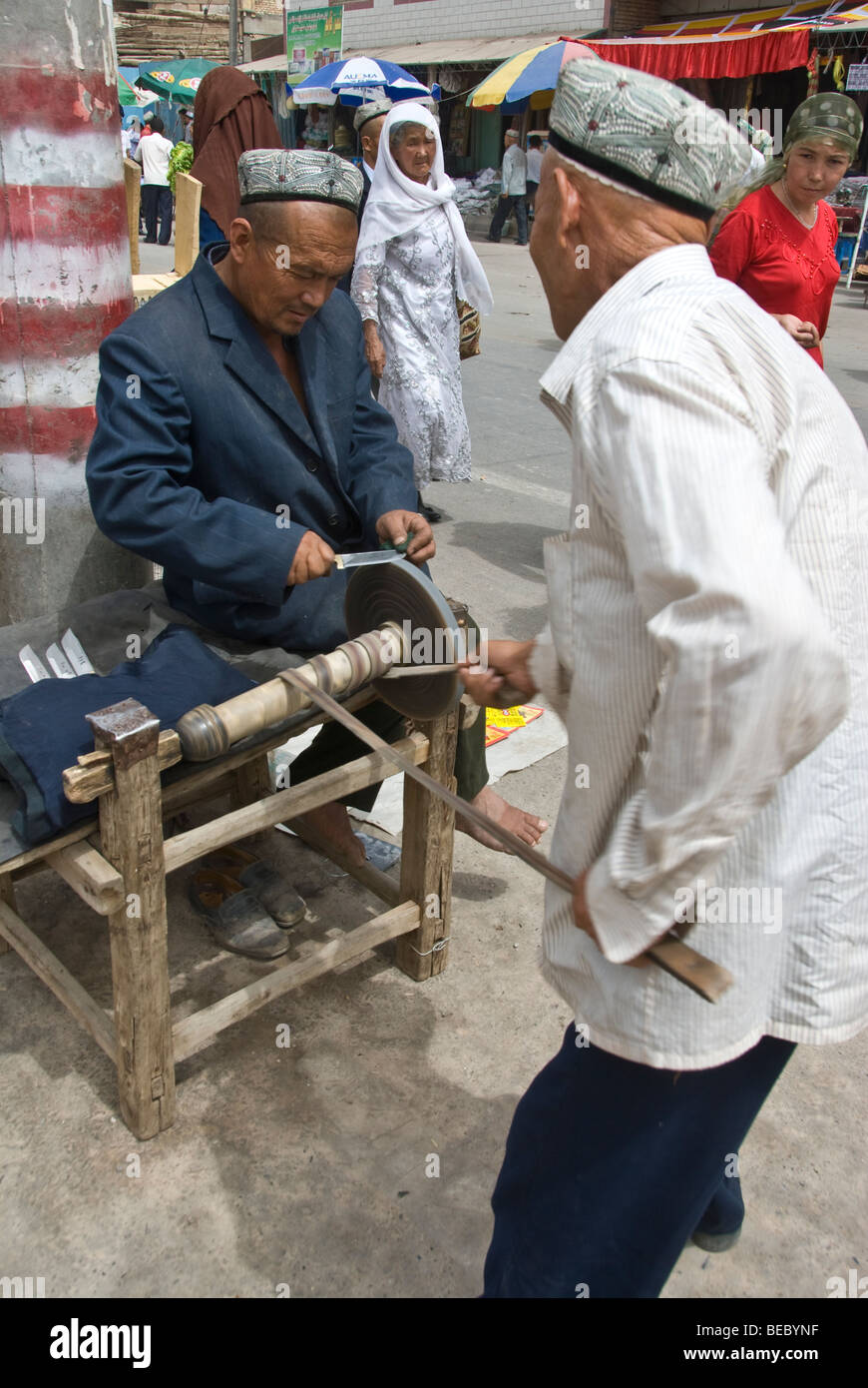 Chinese Blacksmith in a market of Kashgar, Xinjiang Province, China ...