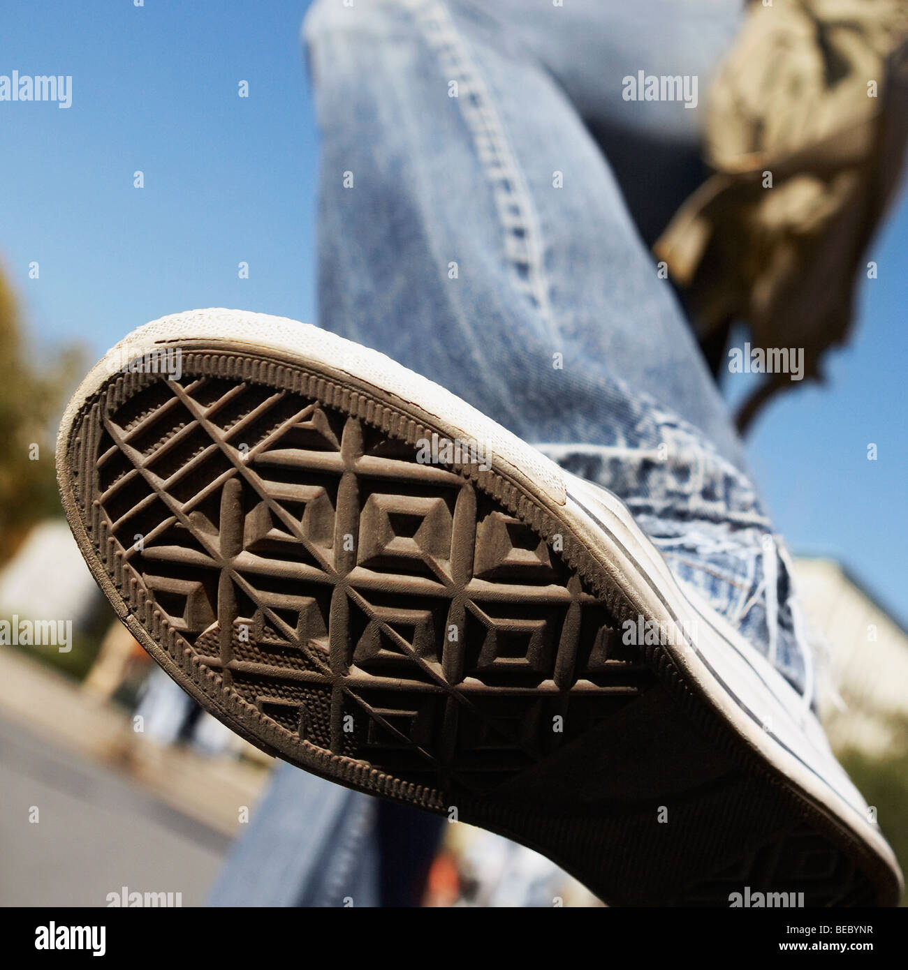 Close-up of a person showing his shoe Stock Photo - Alamy