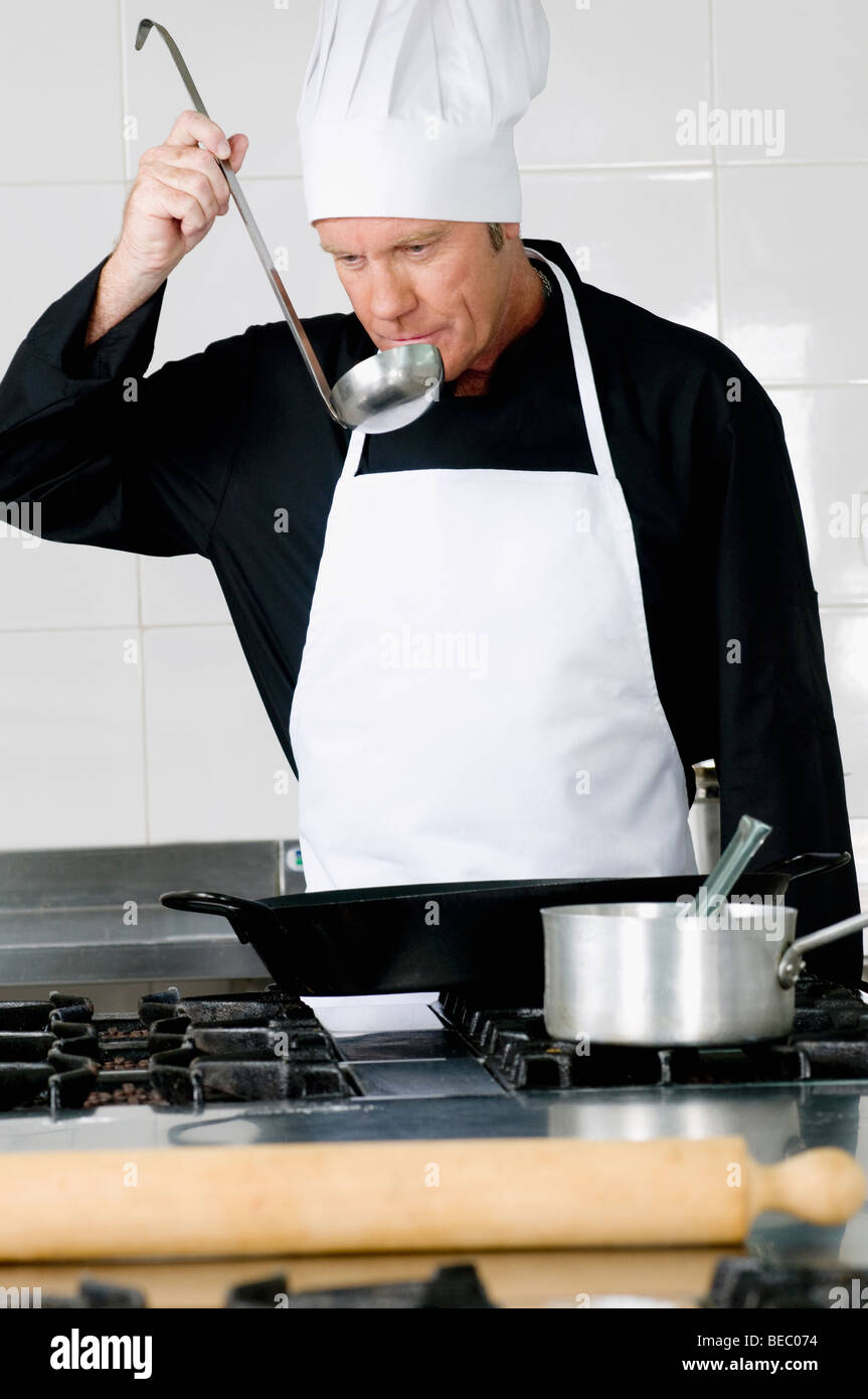 Chef smelling the cooked food Stock Photo - Alamy