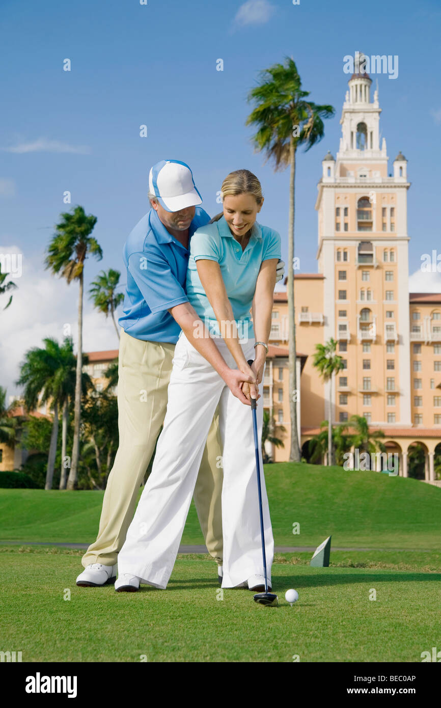 Golf instructor teaching golf to a woman, Biltmore Golf Course ...