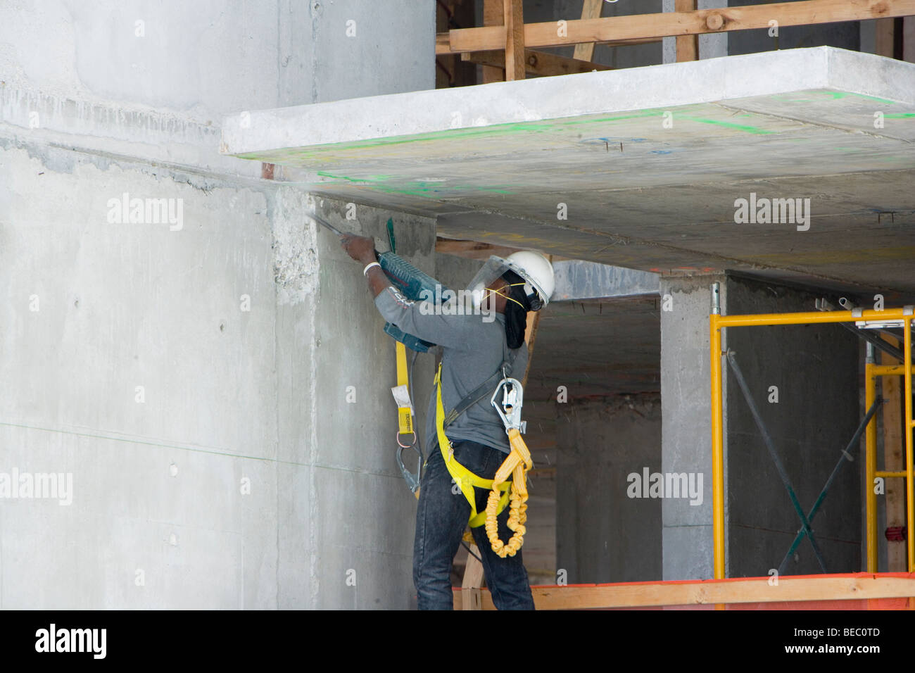 Side view of a construction worker working inside a building Stock ...