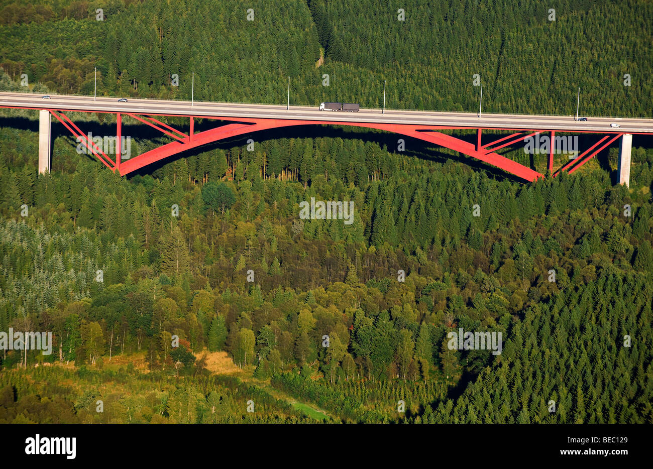 Aerial view : Red highway bridge crossing a big forest Stock Photo - Alamy