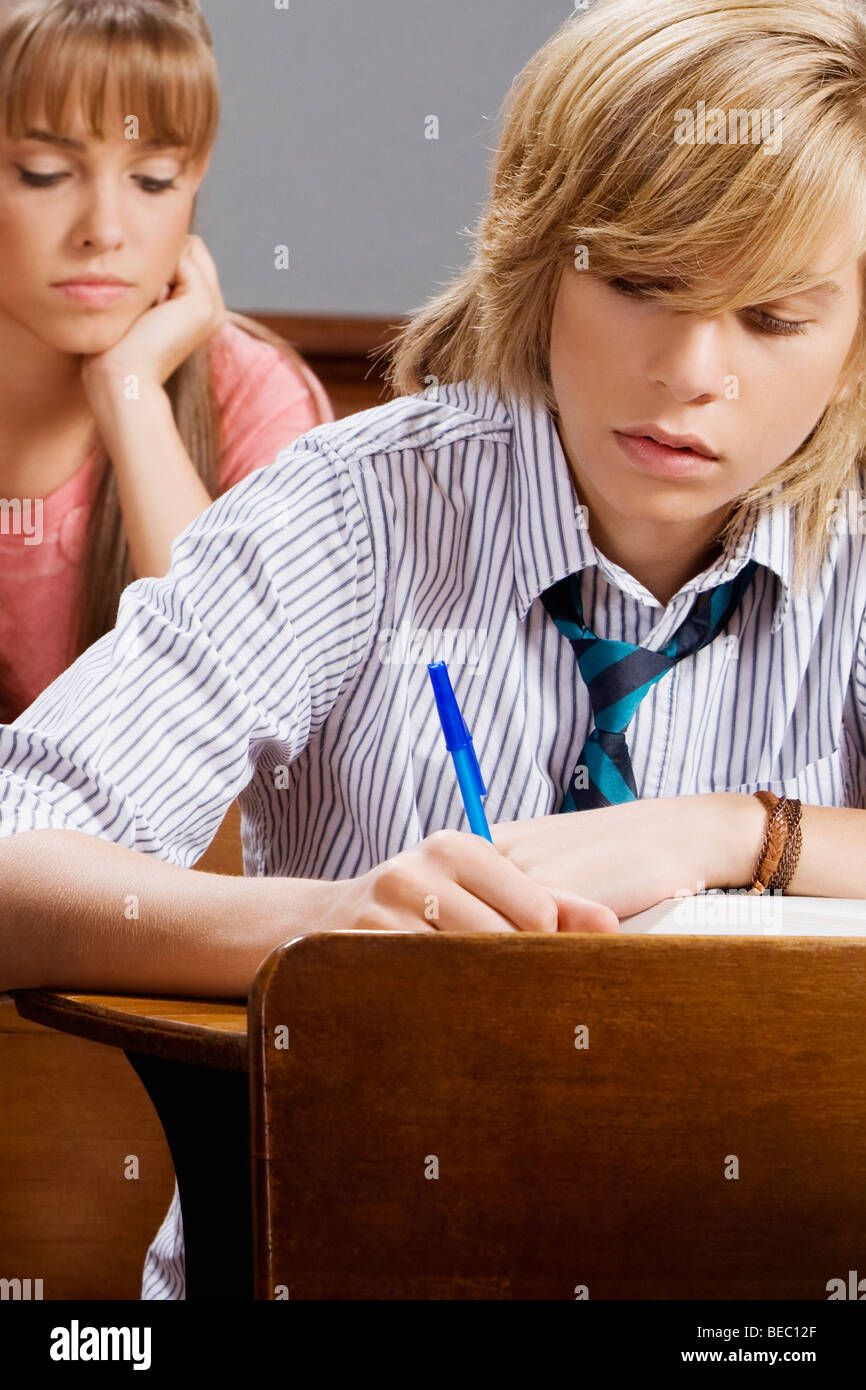 Students giving exam in a classroom Stock Photo - Alamy