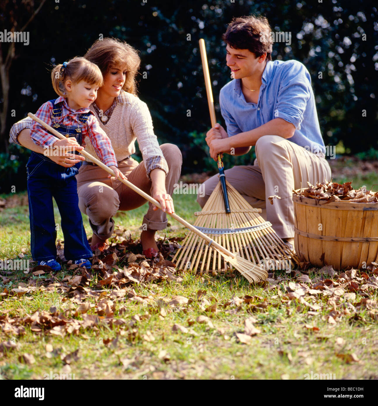 Raking leaves family hi-res stock photography and images - Alamy
