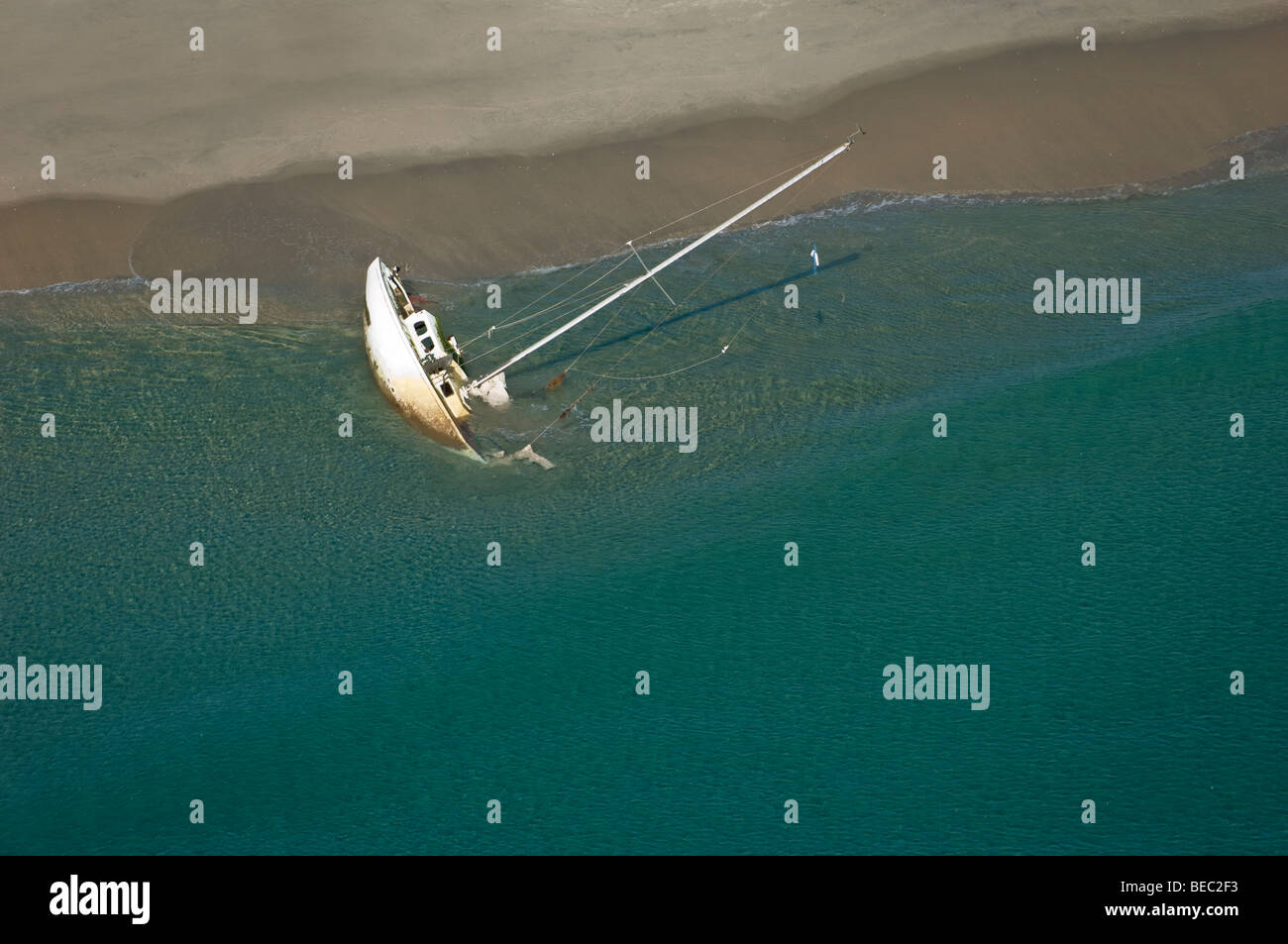 beached sailboat wrecked on sand Stock Photo - Alamy