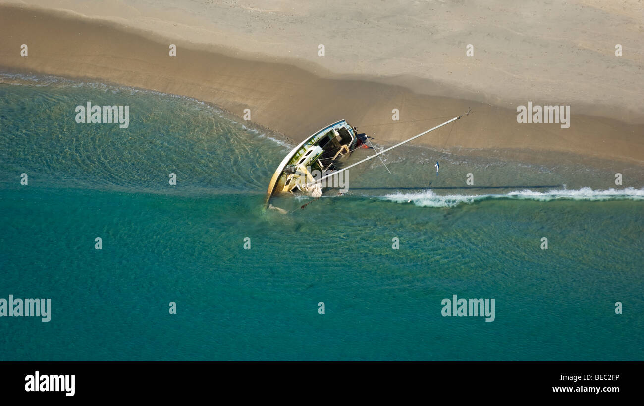 beached sailboat wrecked on sand Stock Photo - Alamy