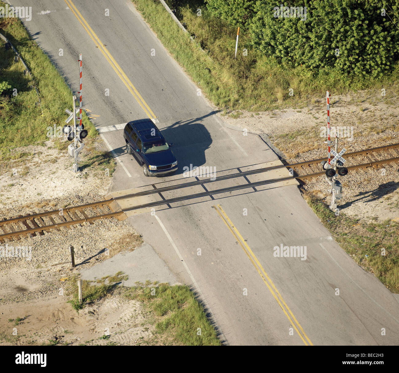 SUV going over a rural railroad crossing Stock Photo - Alamy