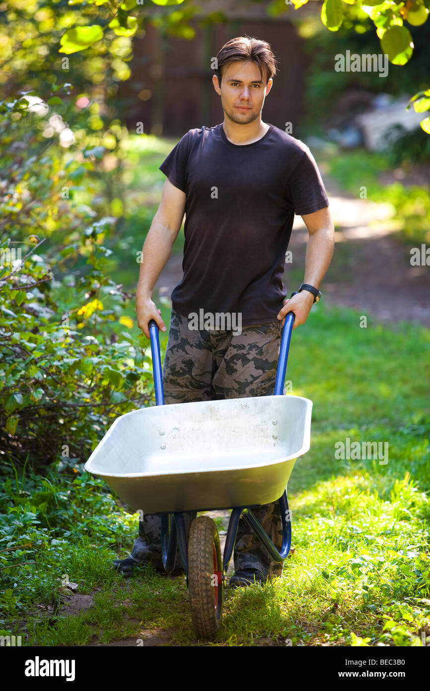 Worker with wheelbarrow hi-res stock photography and images - Alamy
