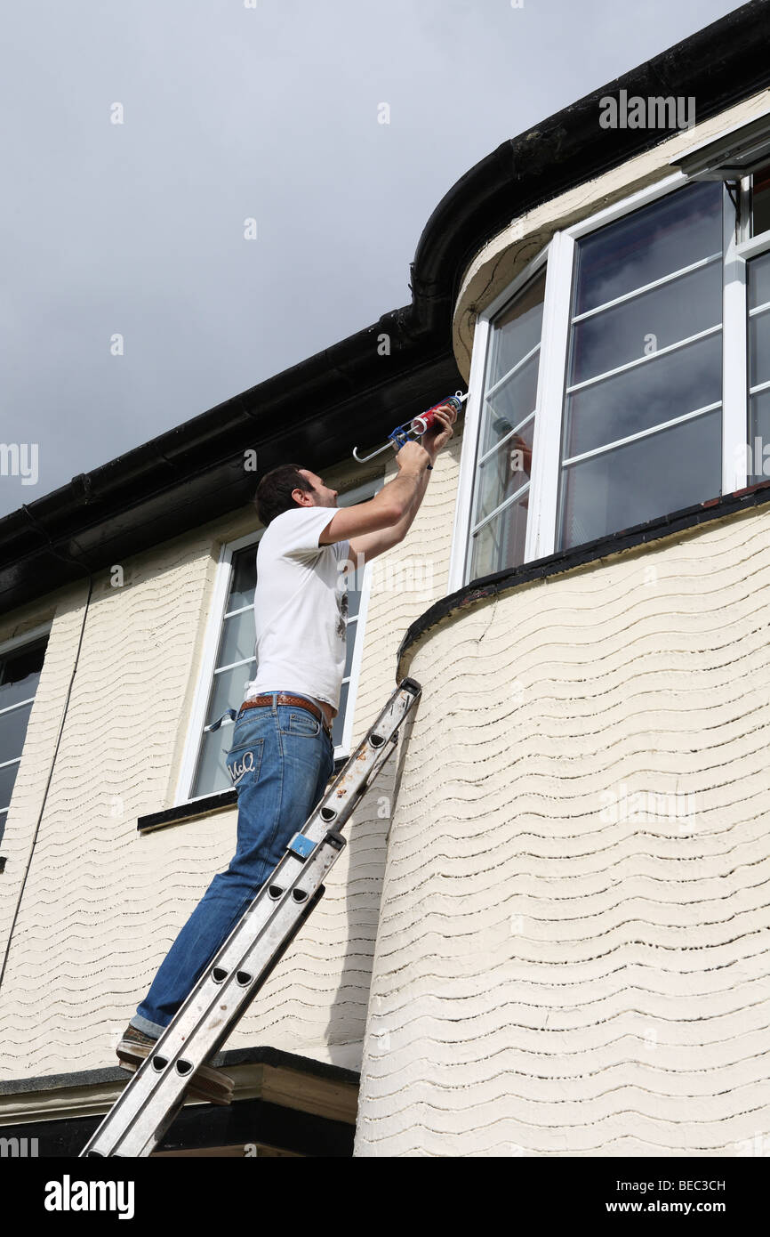 Man Working On Ladder High Resolution Stock Photography and Images - Alamy