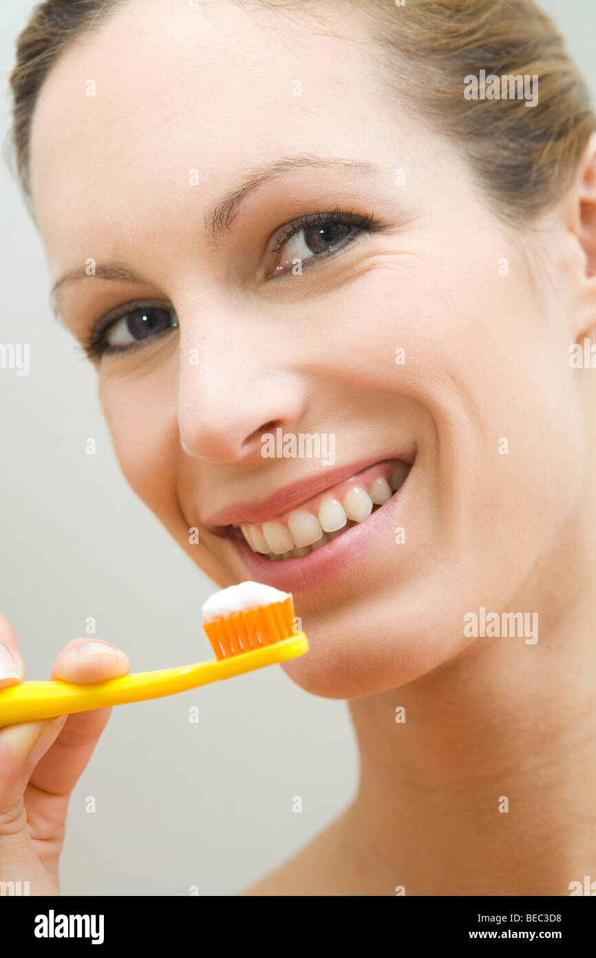 Woman brushing teeth Stock Photo - Alamy