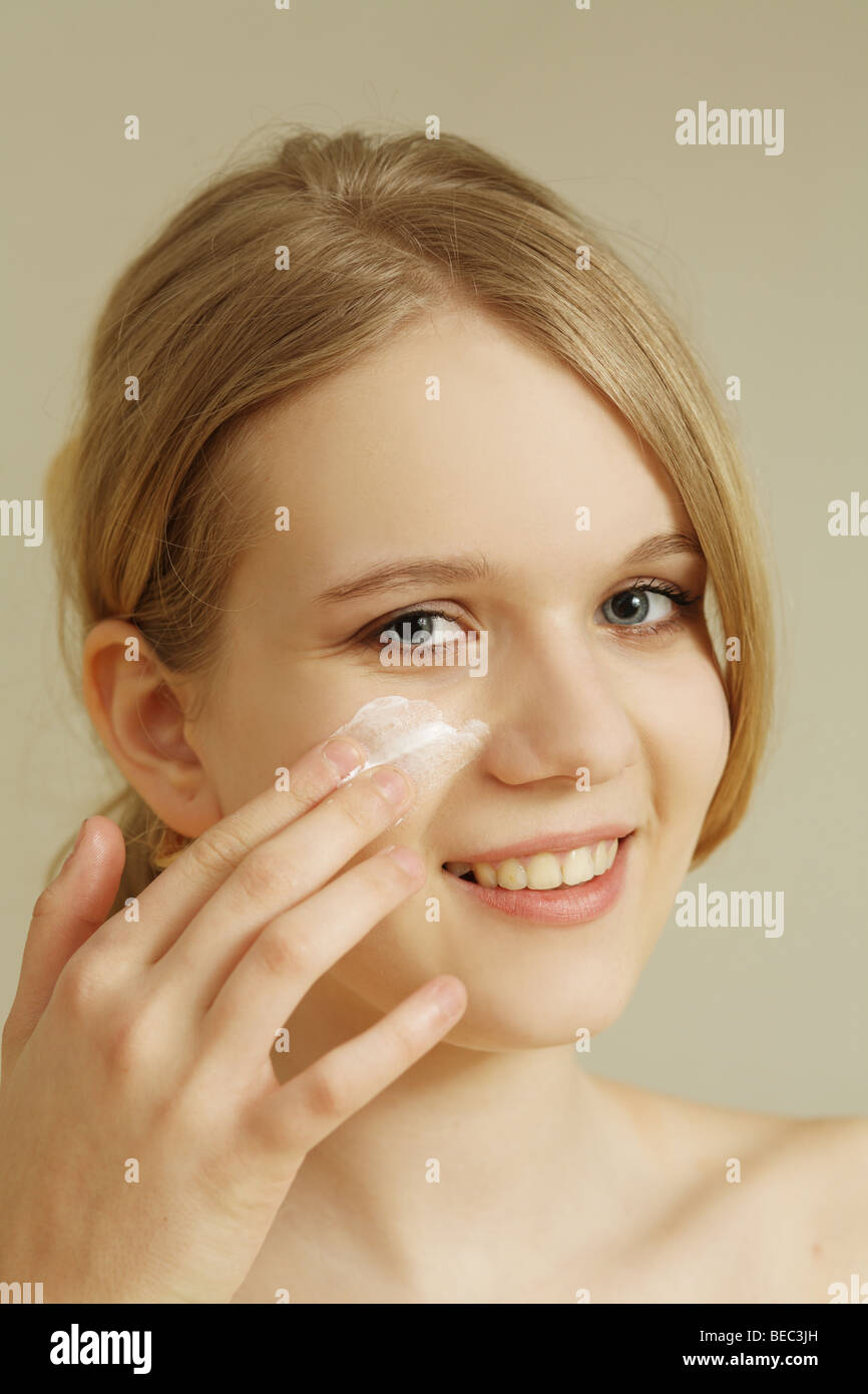 Woman Creaming Face High Resolution Stock Photography and Images - Alamy