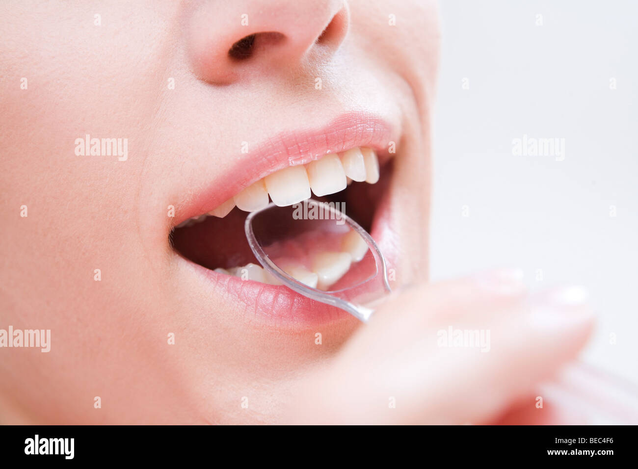 Woman examine teeth herself Stock Photo - Alamy