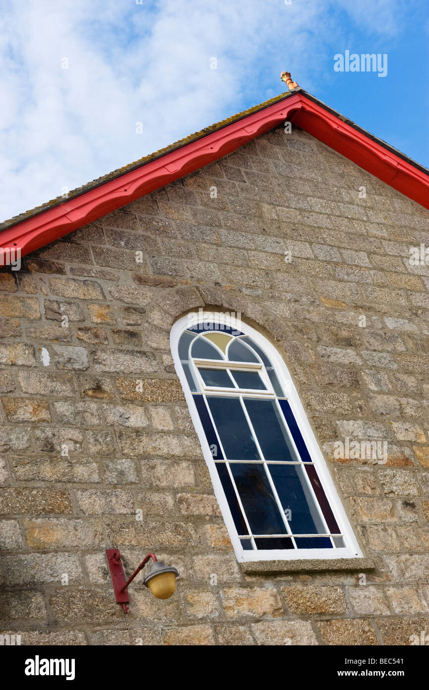a small window in the side of a brick built house in St Ives Cornwall ...