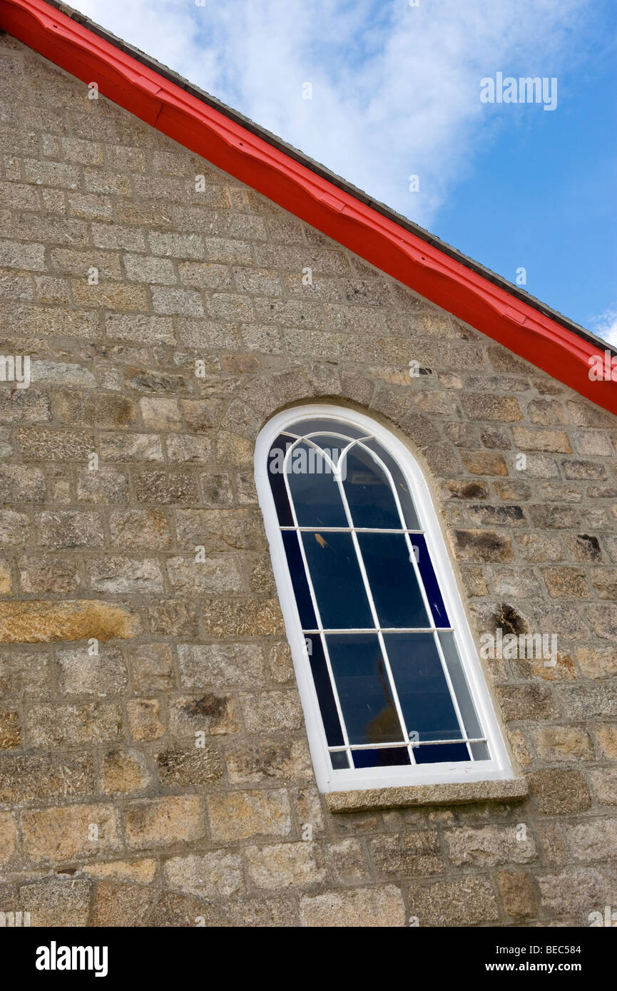 a small window in the side of a brick built house in St Ives Cornwall ...