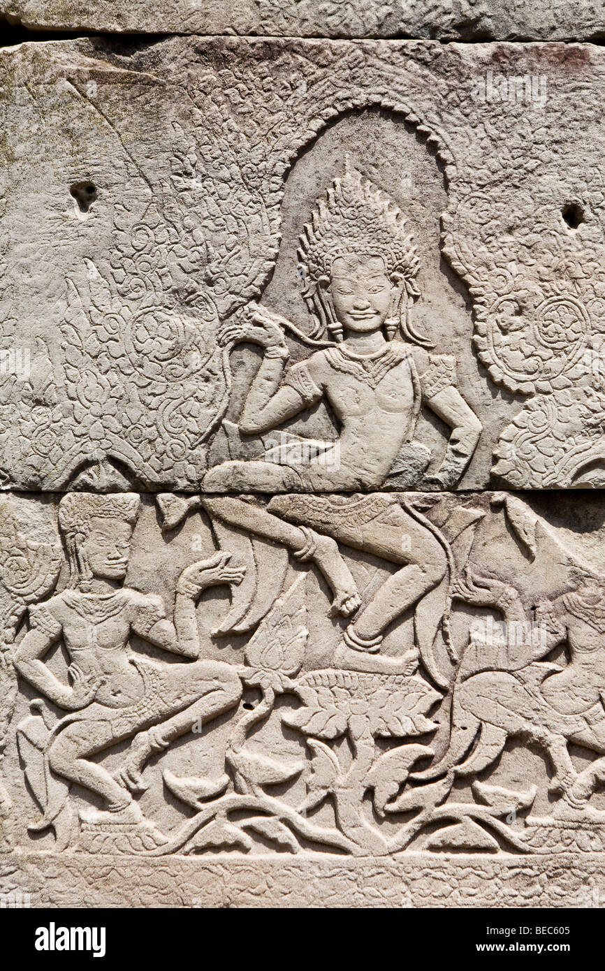 Carved bas relief designs on a temple at Angkor in Cambodia Stock Photo ...