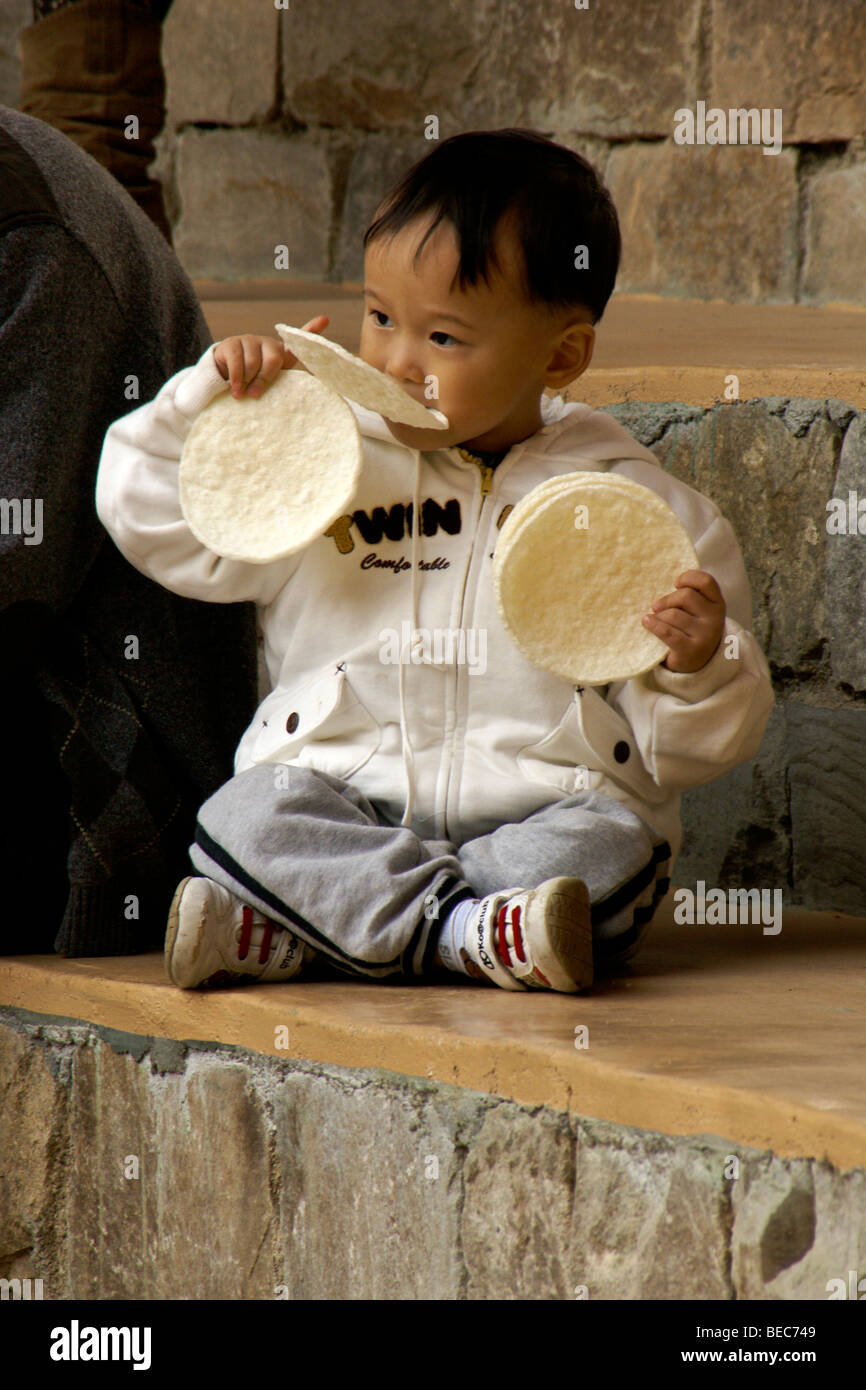 Asia child eating rice hi-res stock photography and images - Alamy