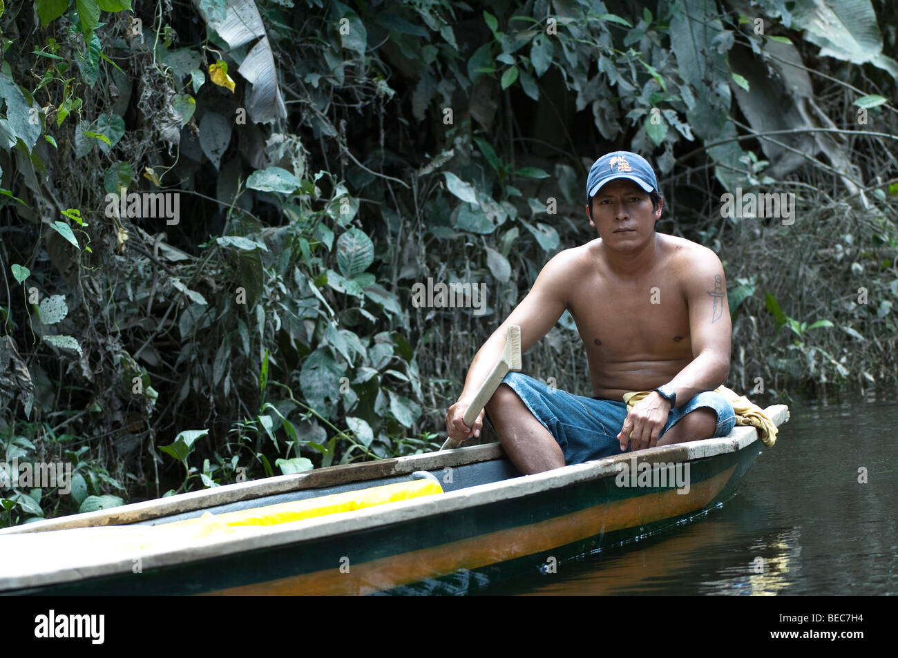 Anangu Quichua man in canoe Anangucocha Lake Napo Wildlife Centre ...