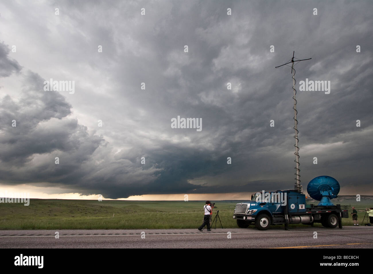 Storm chasers with Project Vortex 2 watch a distant wall cloud and ...