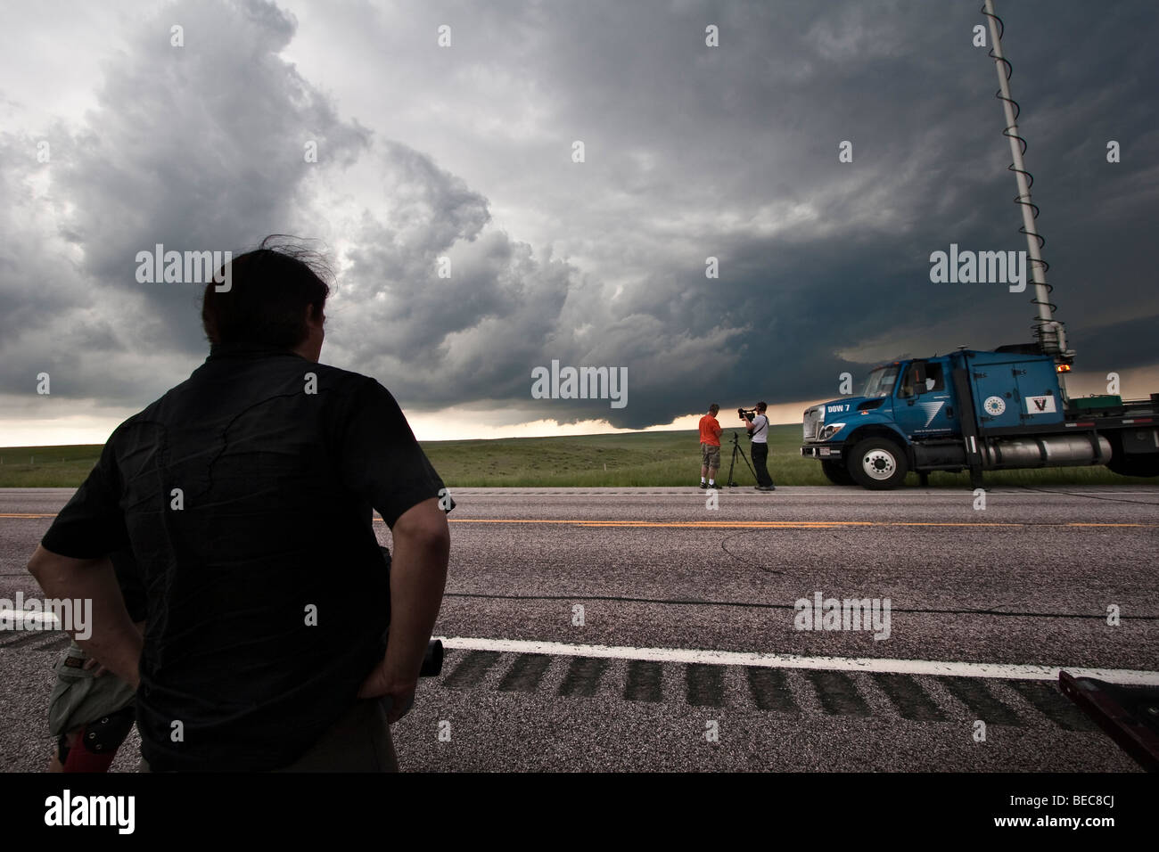 Storm chasers with Project Vortex 2 watch a distant wall cloud and ...
