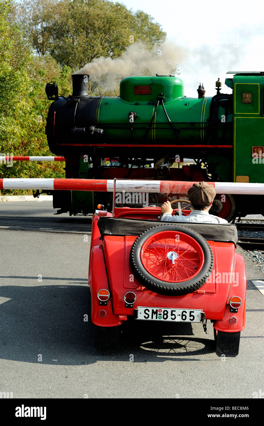 Steam Locomotive coal tank engine railway station with Aero veteran car ...