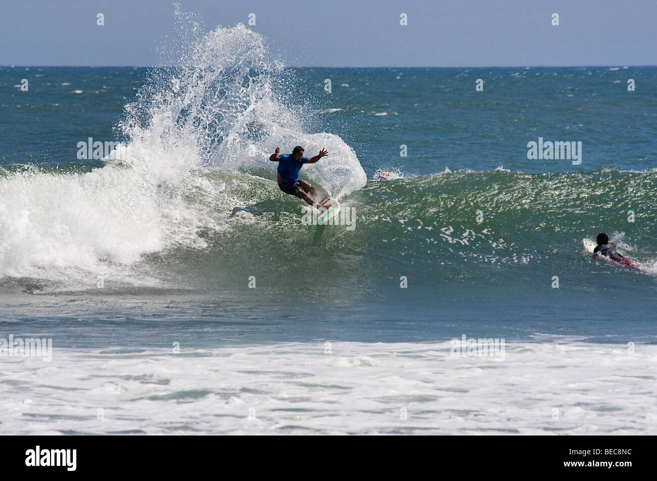 Surf Indonesia. Surfer on the long left wave in Medewi village ...