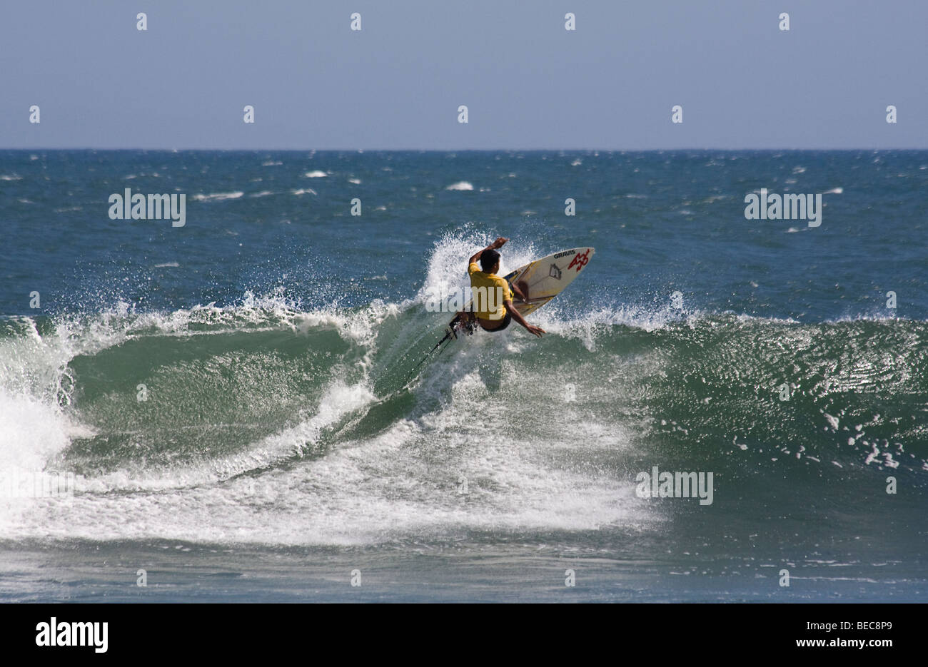 Surf Indonesia. Surfer on the long left wave in Medewi village ...